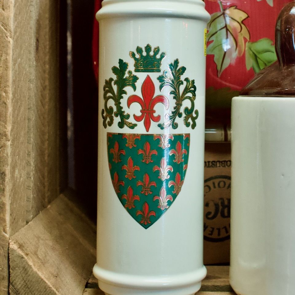 White bottle w/ stopper & crest